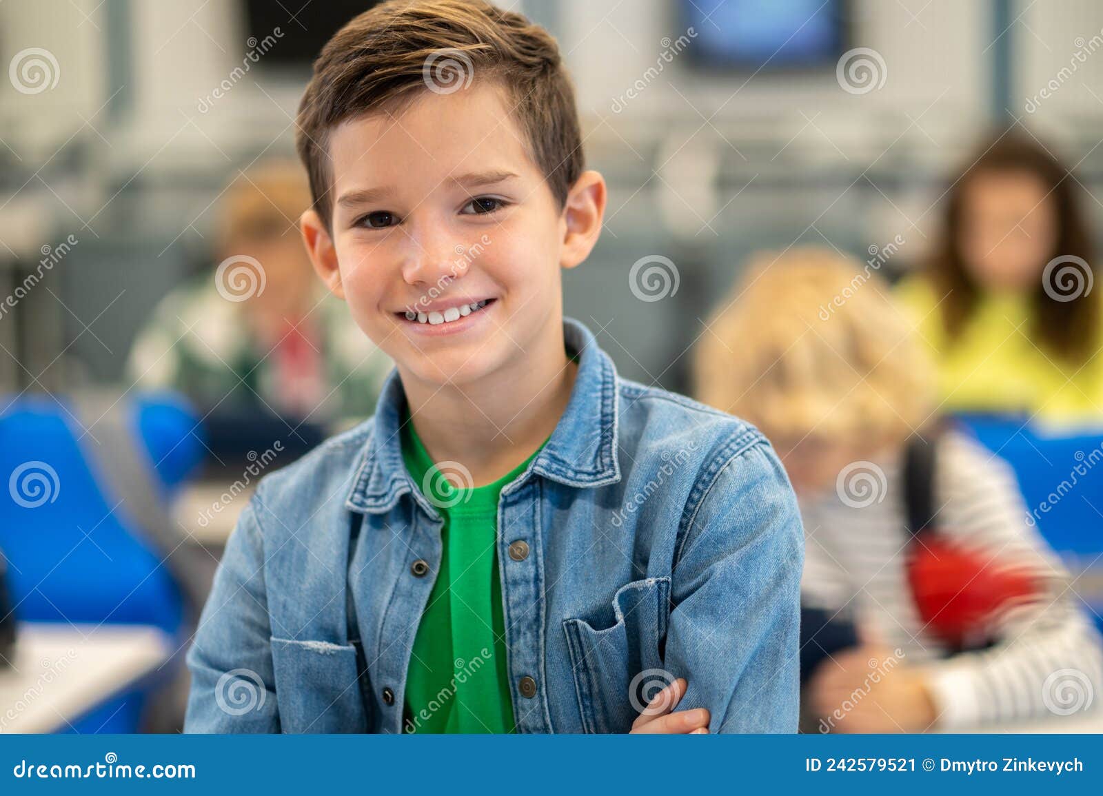 Boy Smiling Confidently at Camera in Class Stock Image - Image of ...