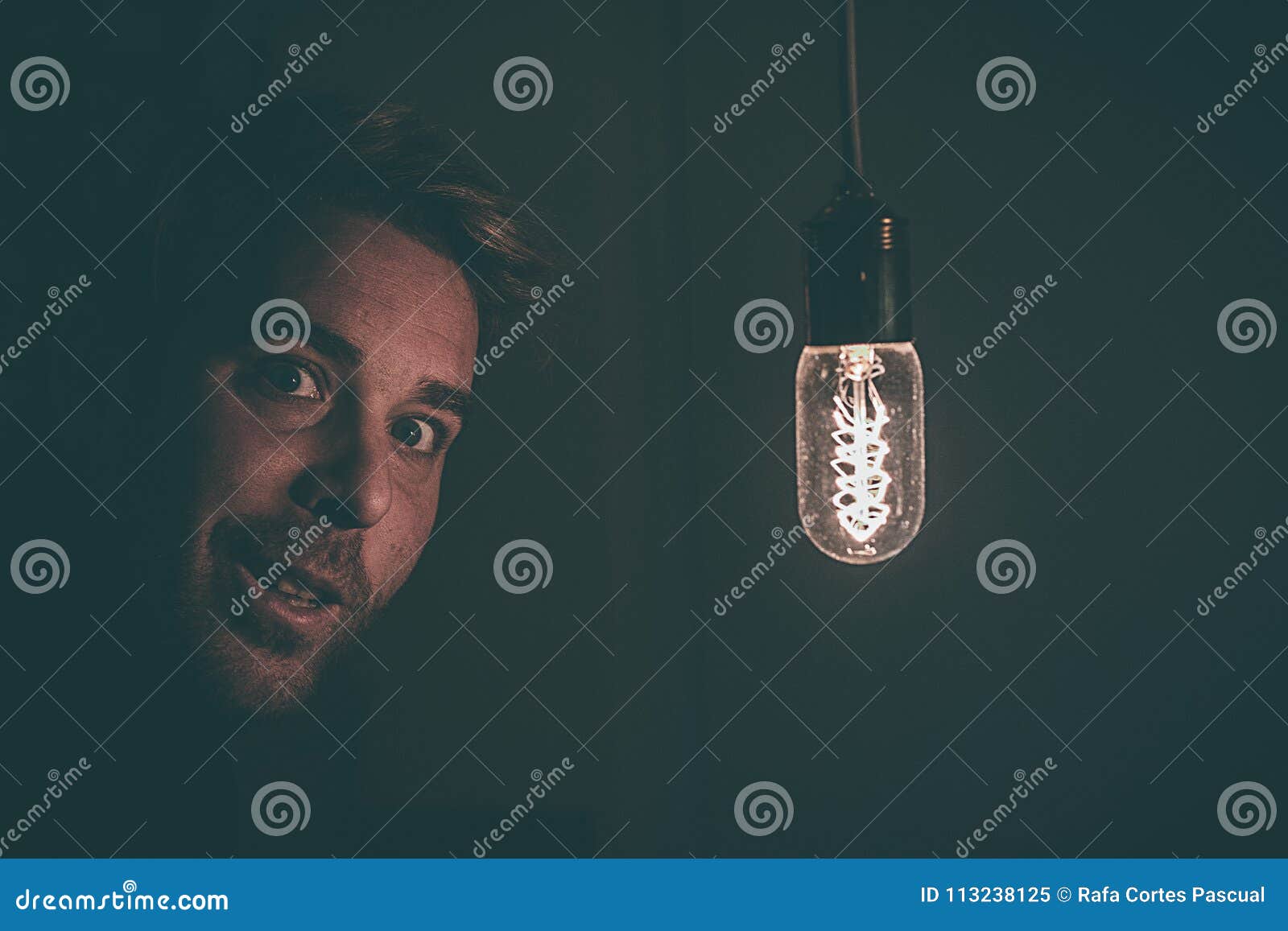 Boy Smiling with a Light Bulb on His Face Stock Image - Image of ...