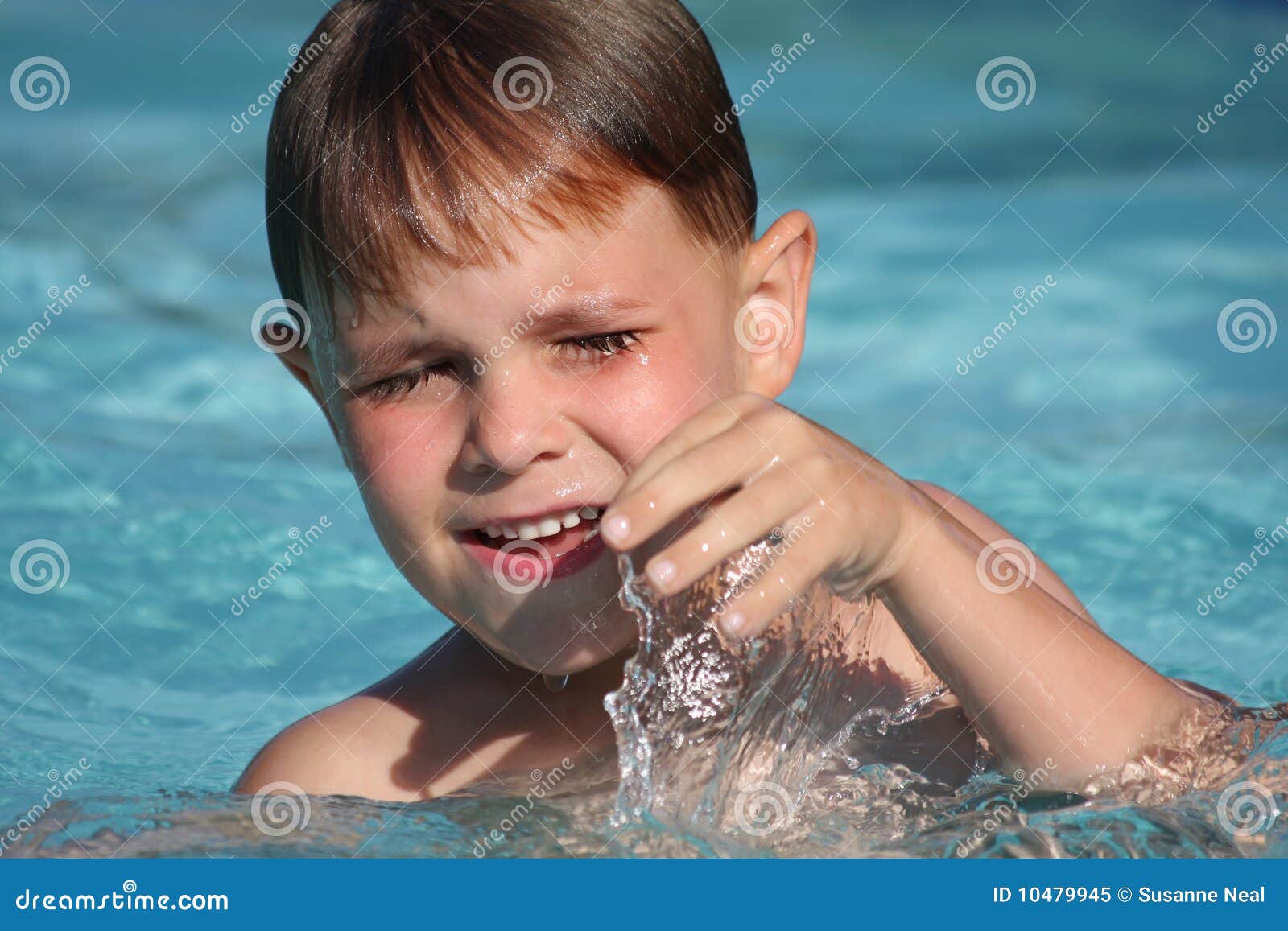 Boy Smiling in Swimming Pool Stock Image - Image of summer, outside ...