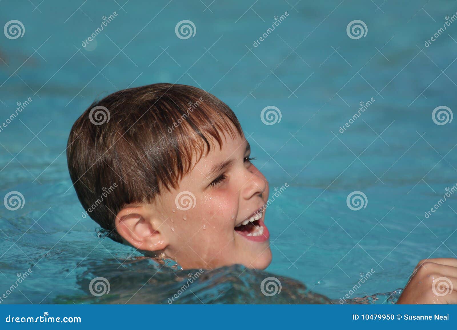 Boy Smiling in Swimming Pool Stock Photo - Image of eyes, cheerful ...