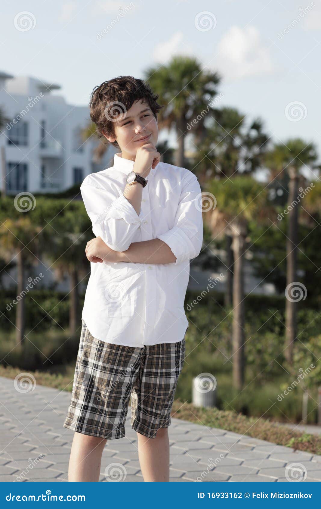Boy smiling and thinking stock photo. Image of outdoors - 16933162