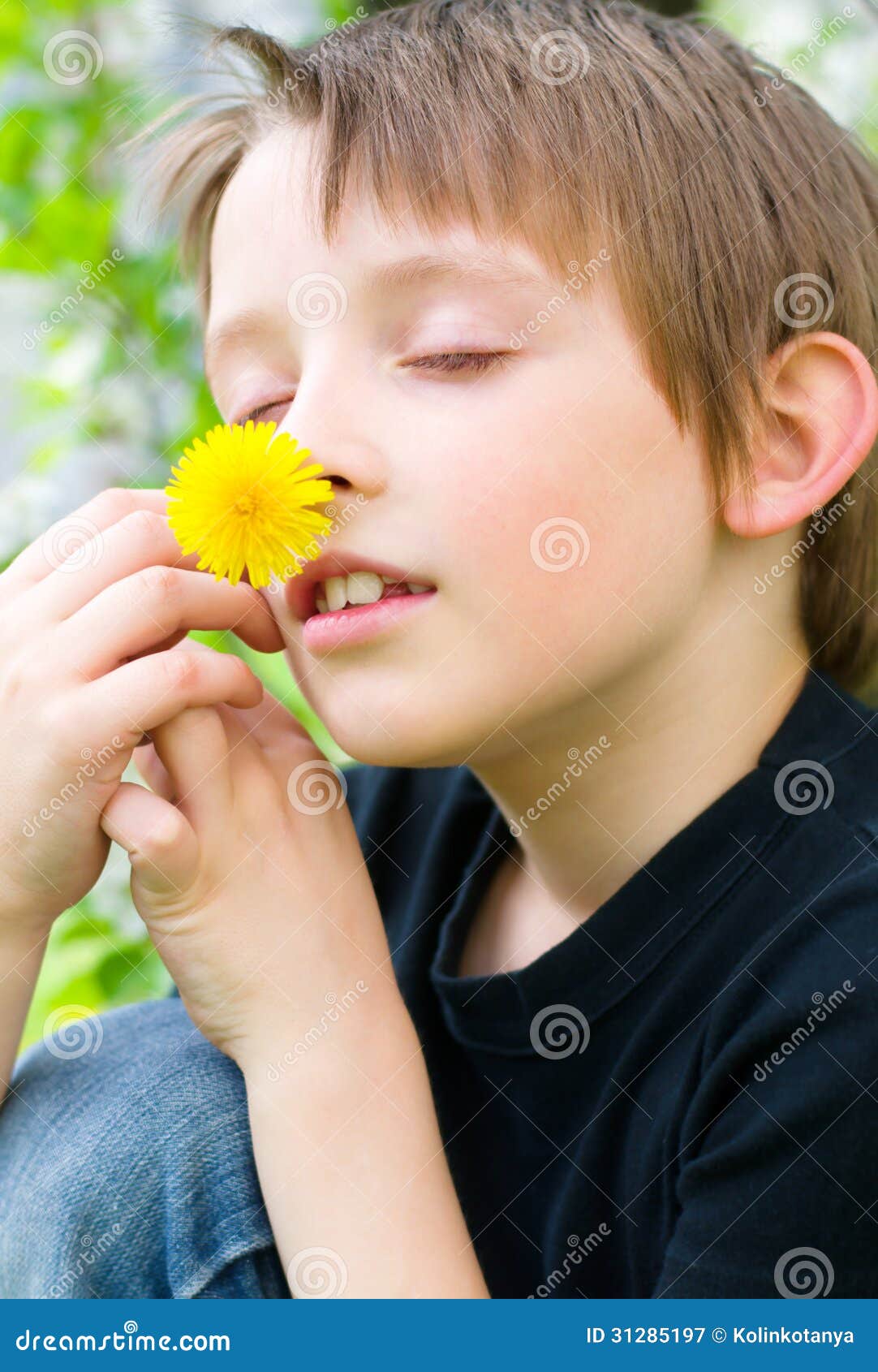 Boy sniffing yellow flower stock image. Image of beautiful - 31285197