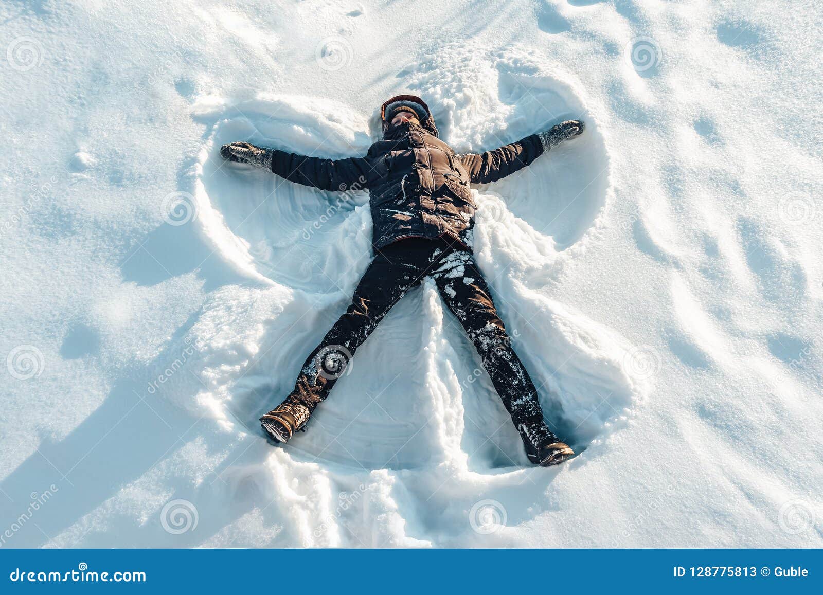 The Boy on a Snow Flapping Arms and Legs Angel Shows Stock Image ...