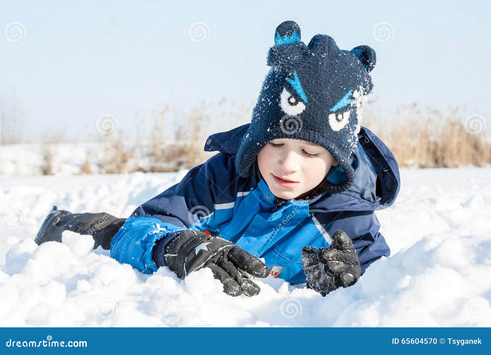 A boy in snow stock photo. Image of outdoor, winter, coat - 65604570