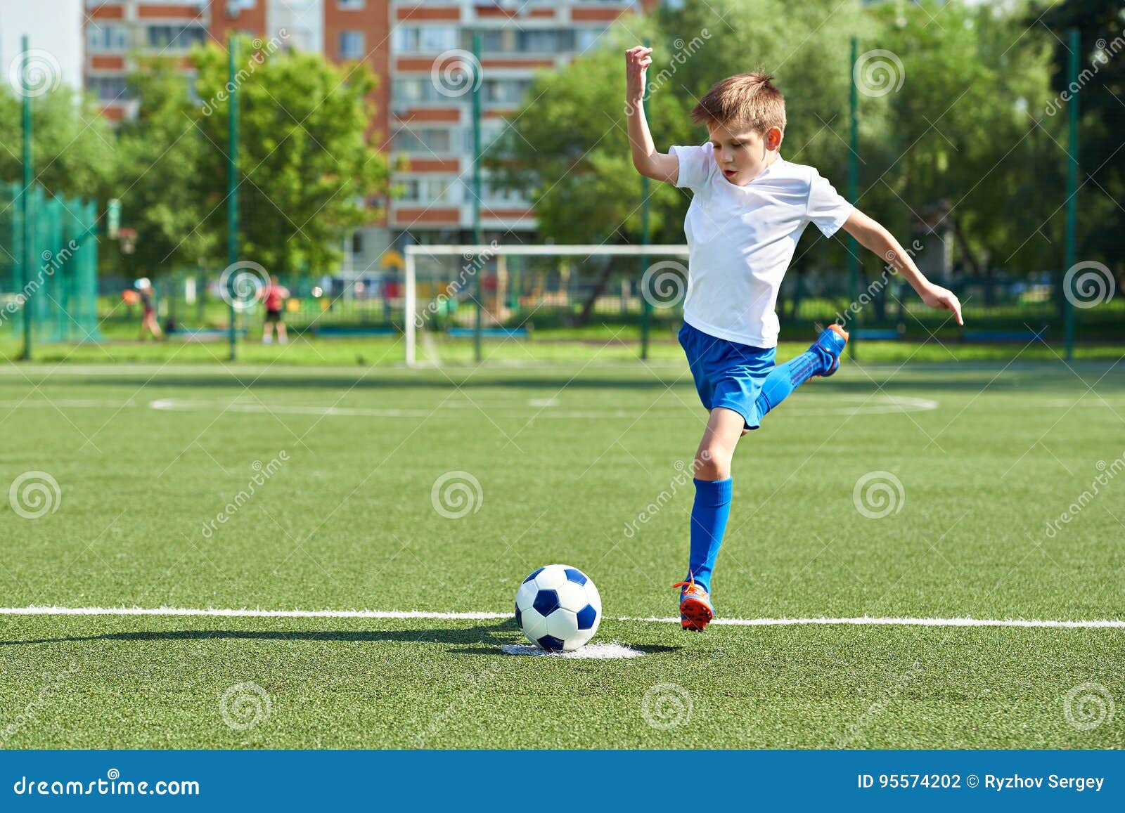 Boy Soccer Player with Jump before Kick on Ball Stock Photo - Image of ...