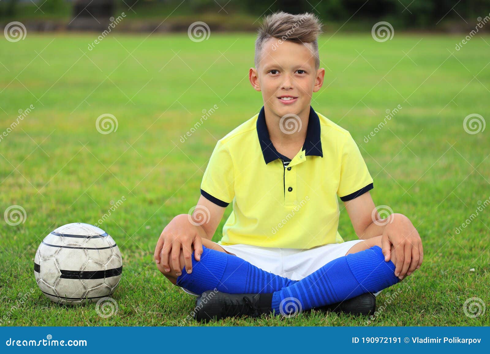 Boy Soccer Player Sitting on the Soccer Field Stock Image - Image of ...