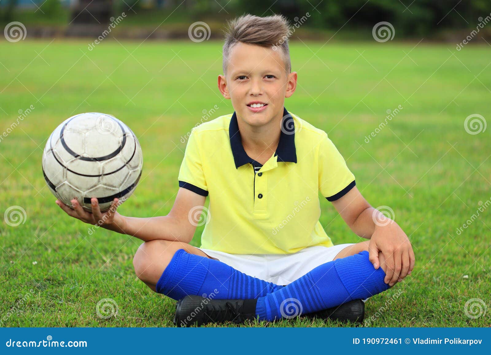 Boy Soccer Player Sitting on the Soccer Field Stock Image - Image of ...