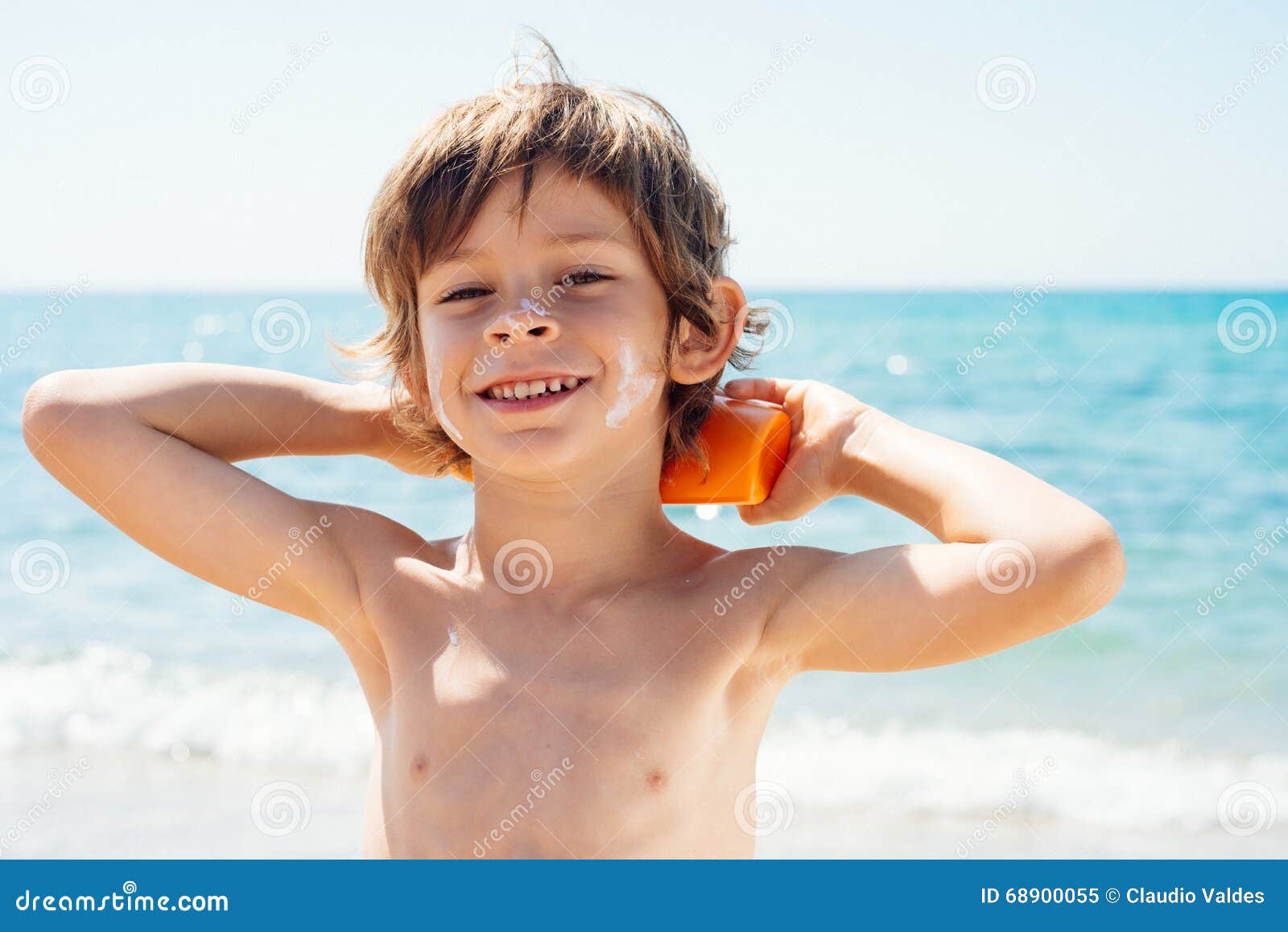 Boy with solar protection stock image. Image of game - 68900055