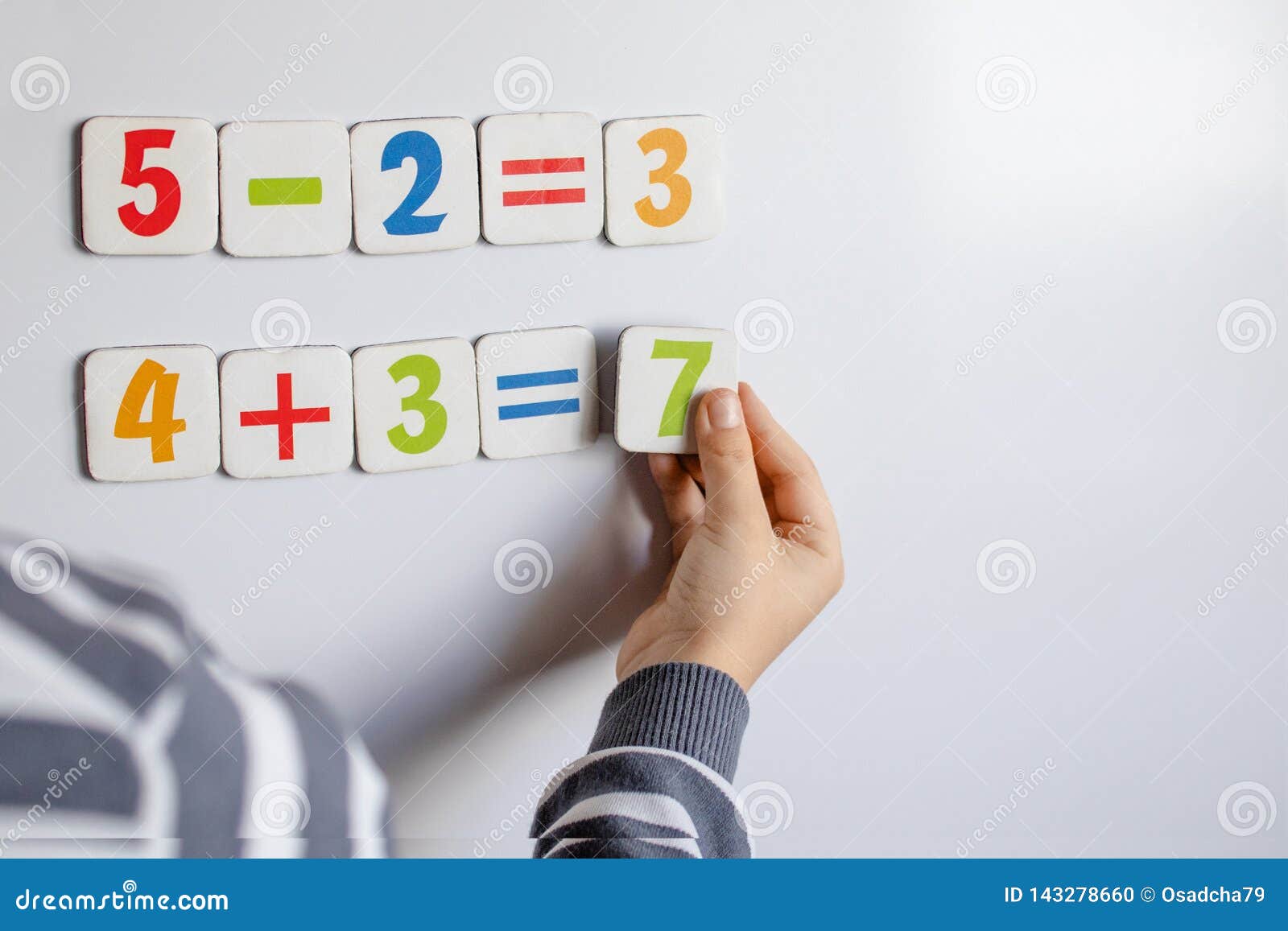 The Boy Solves Mathematical Examples. A Child Solves Examples On A ...