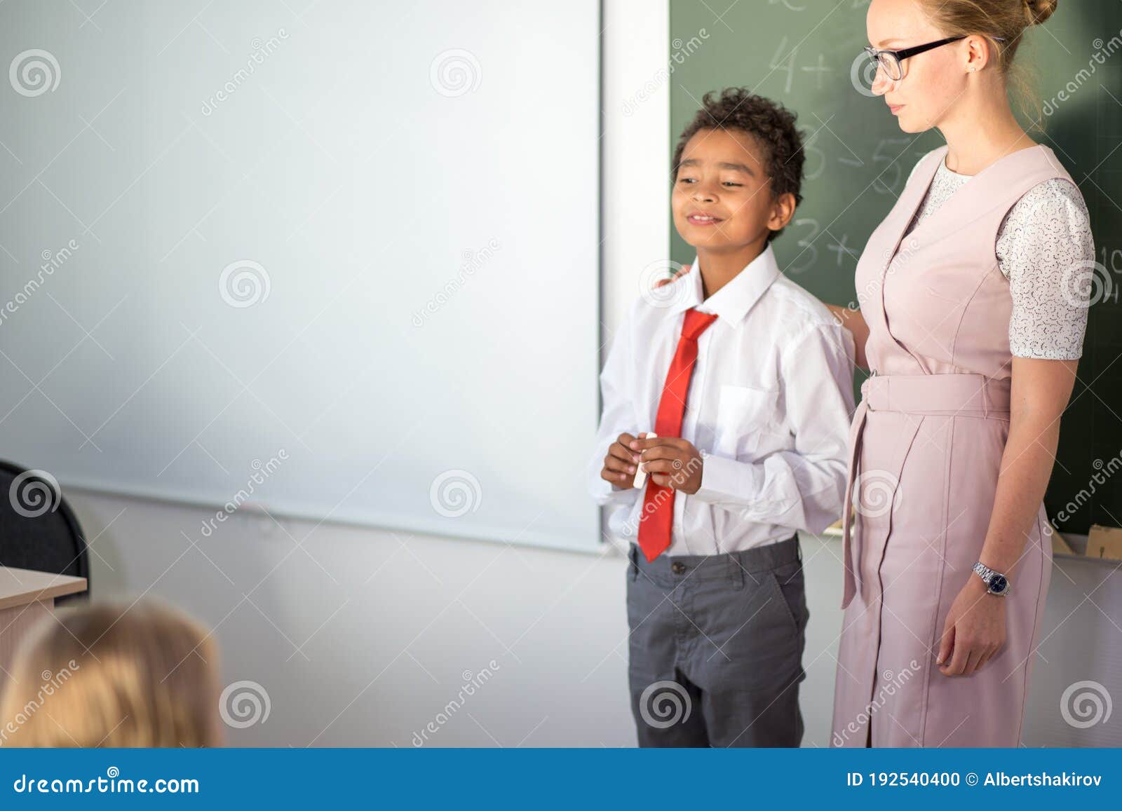 Boy Solving Addition And Subtraction On Board. Schoolboy Writing ...