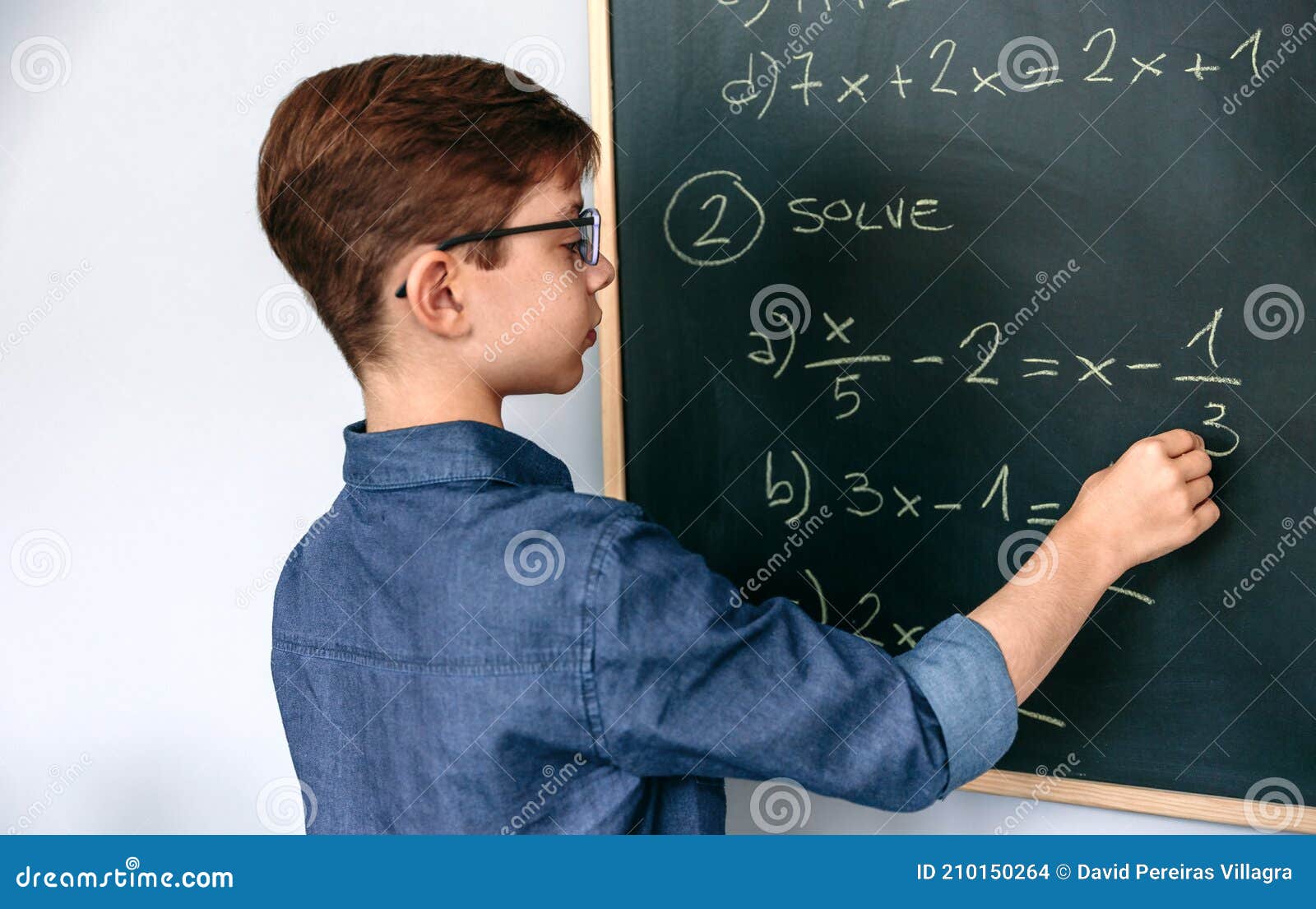 Boy Solving Math Exercises on Blackboard Stock Photo - Image of ...