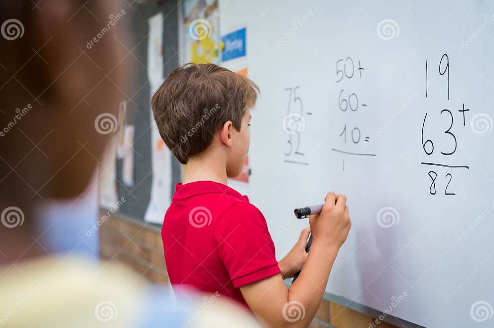 Boy solving math problem stock image. Image of school - 115139391