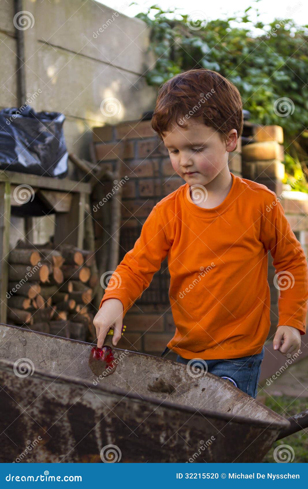 Boy with Spade and Wheelbarrow Stock Photo - Image of outdoors, child ...