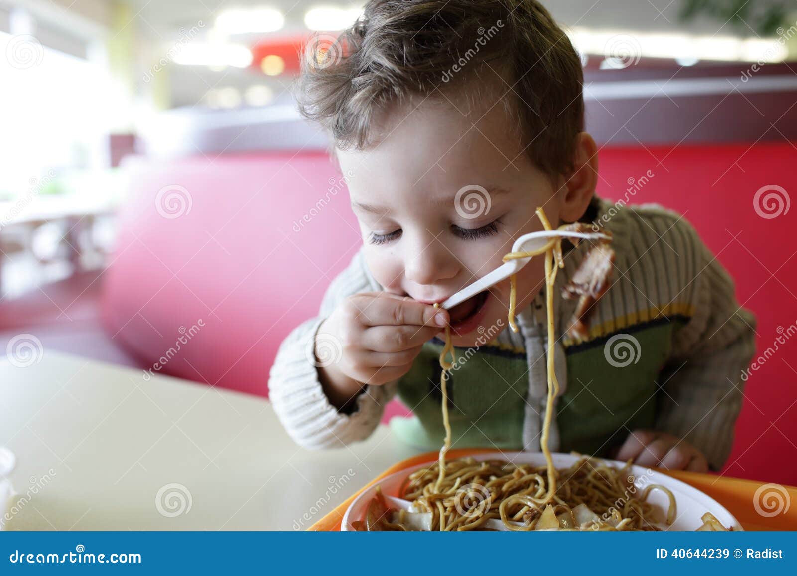 Boy with spaghetti stock image. Image of holding, facial - 40644239
