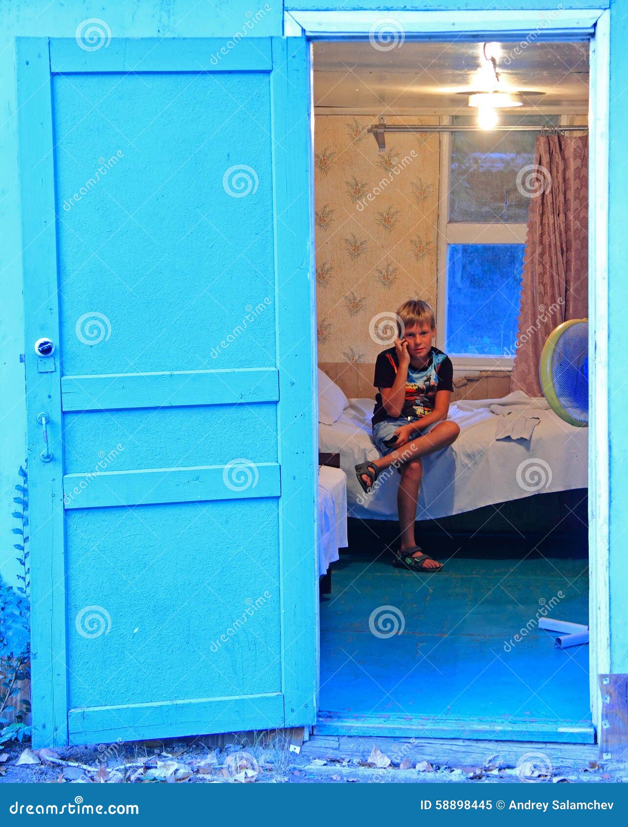 Boy is Speaking Phone Inside Home with Open Door Stock Image - Image of ...
