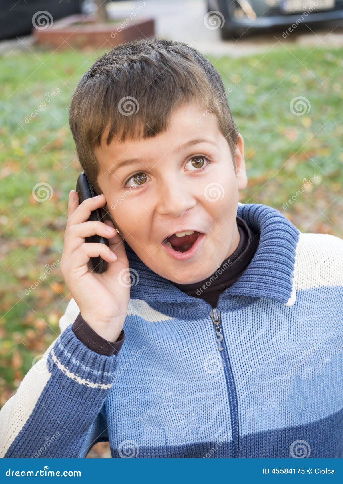 Boy speaking at the phone stock image. Image of network - 45584175