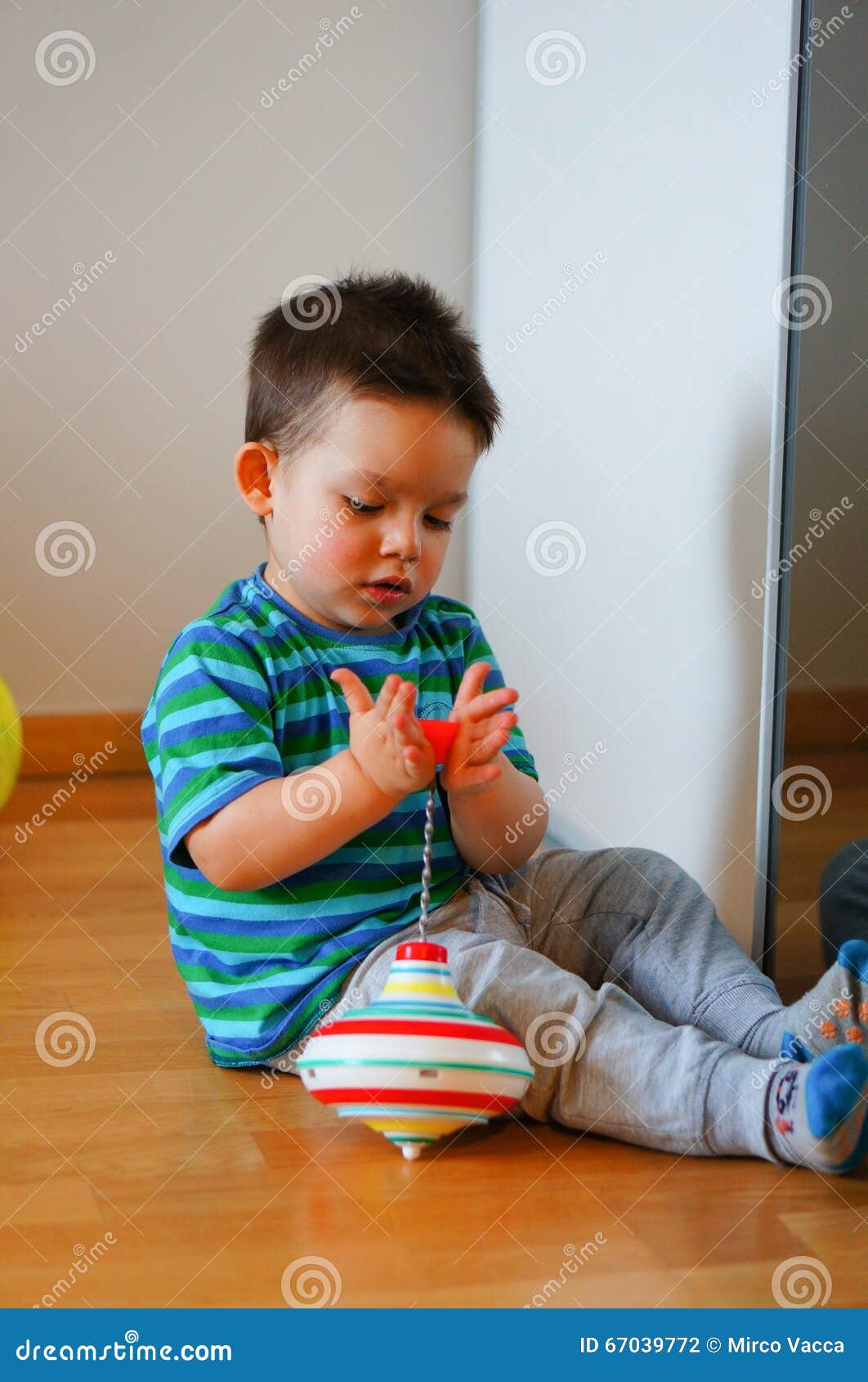 Boy and spin top stock photo. Image of spin, play, indoor - 67039772