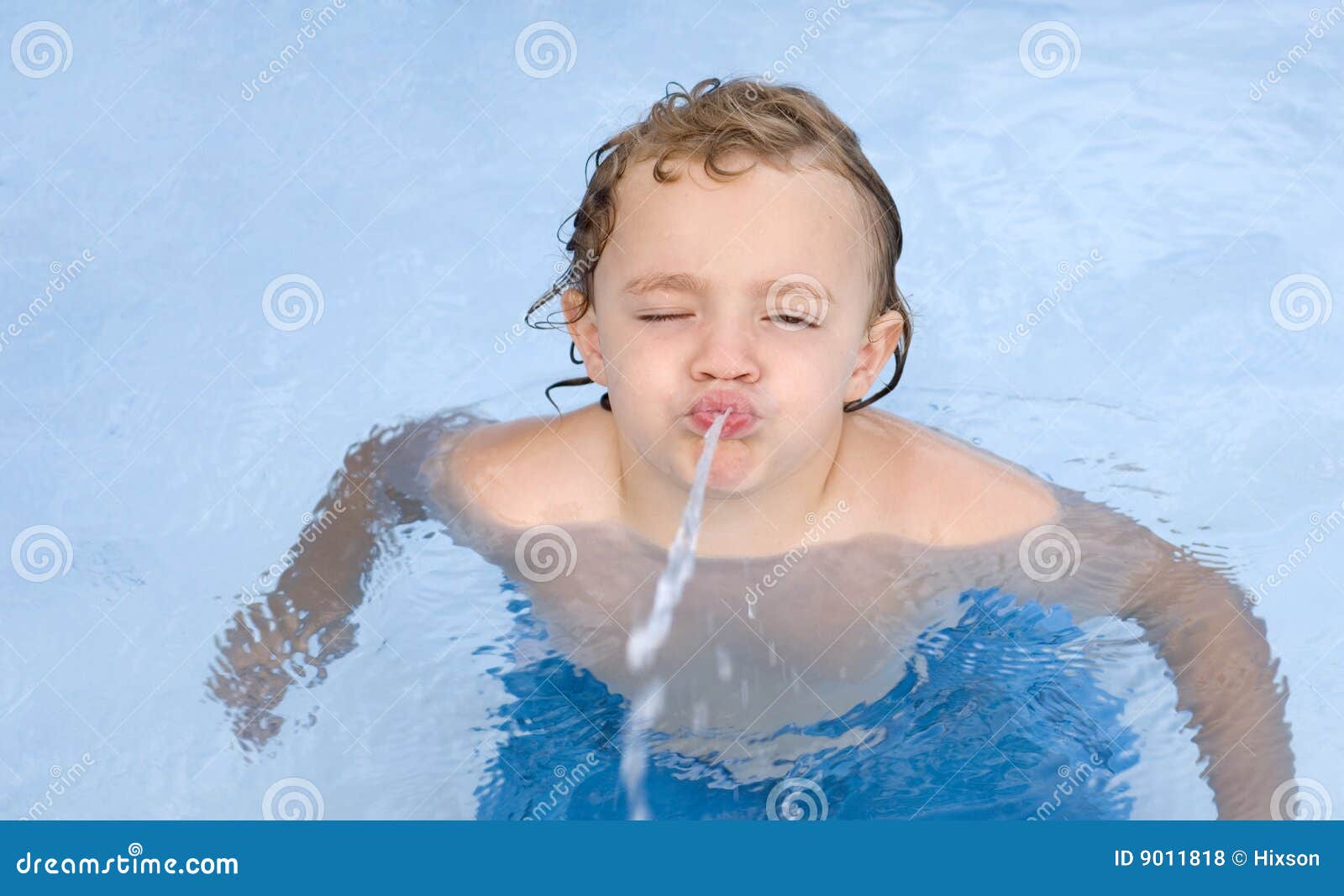 Boy Spitting Water stock photo. Image of spray, youth - 9011818
