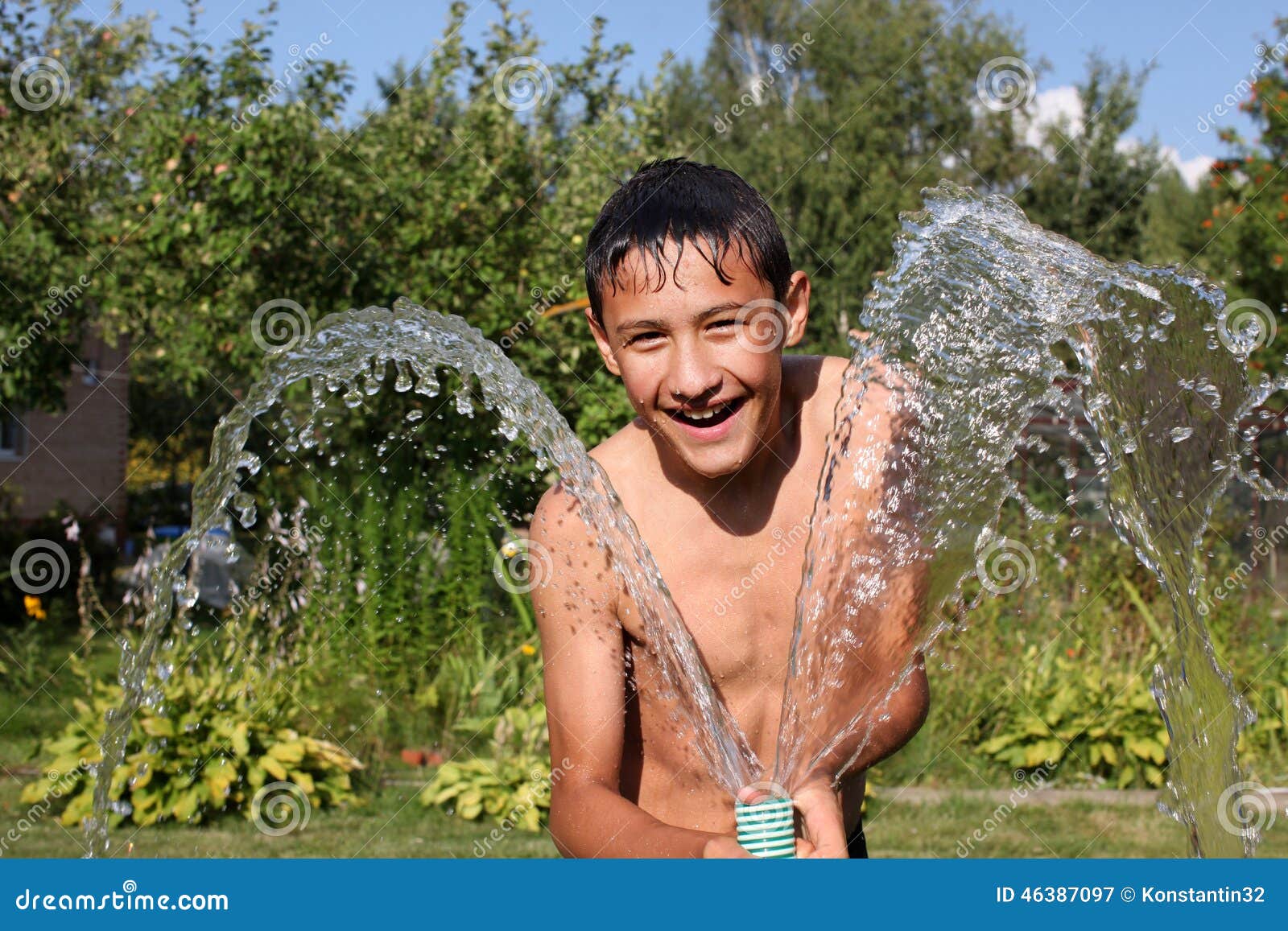 Boy with splash water stock image. Image of cute, outdoors - 46387097