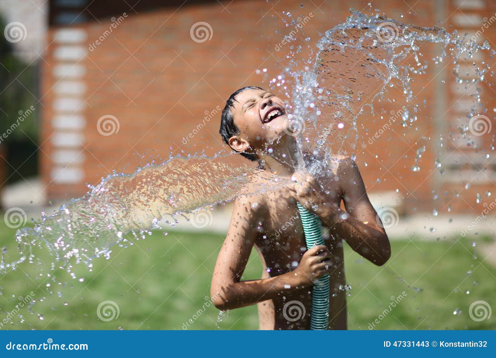 Boy with Splash Water in Hot Summer Day Stock Image - Image of ...