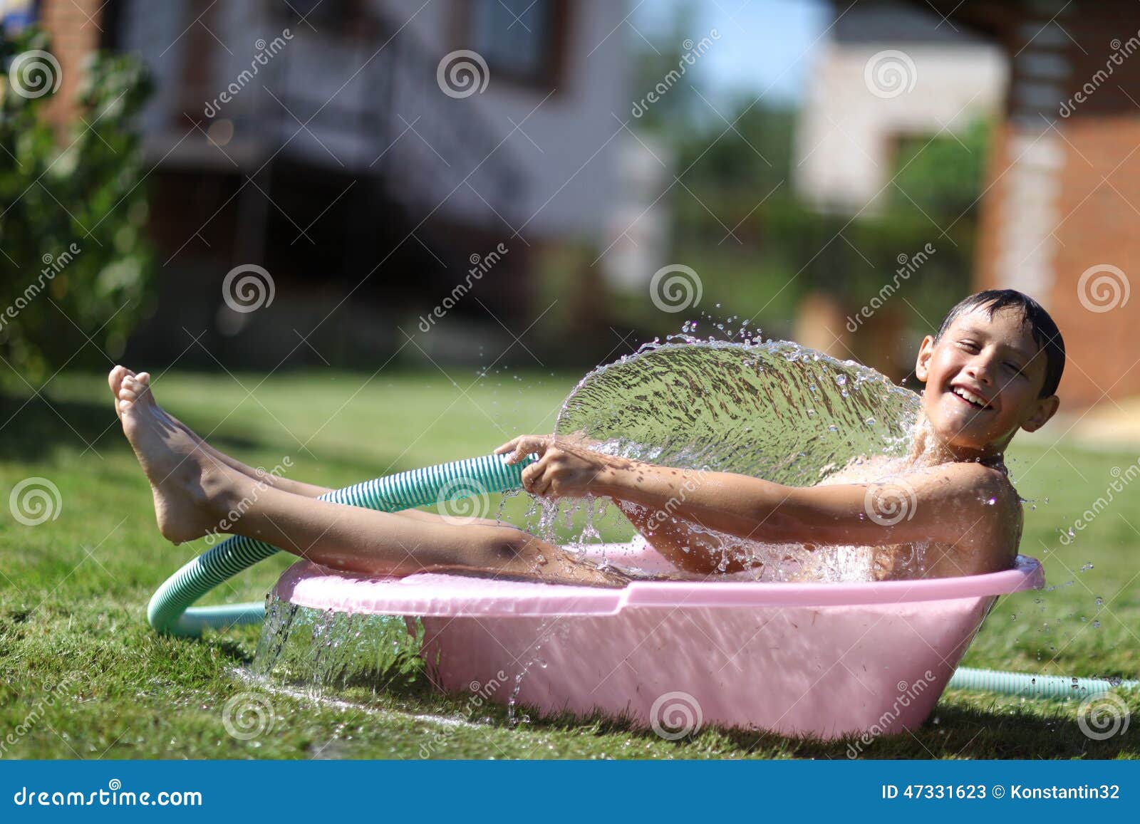 Boy with Splash Water in Hot Summer Day Stock Image - Image of ...