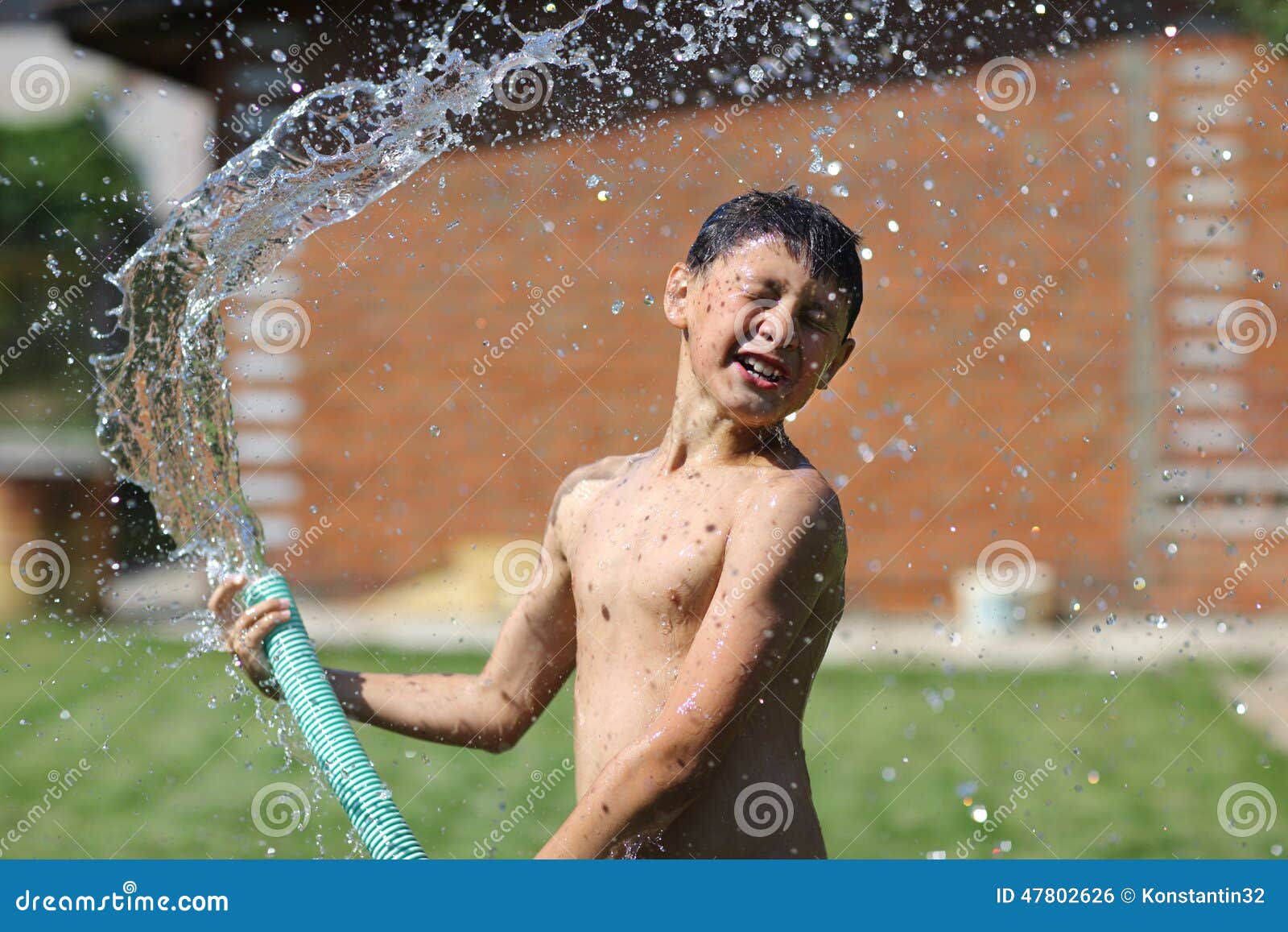 Boy with Splash Water in Hot Summer Day Stock Photo - Image of joyful ...