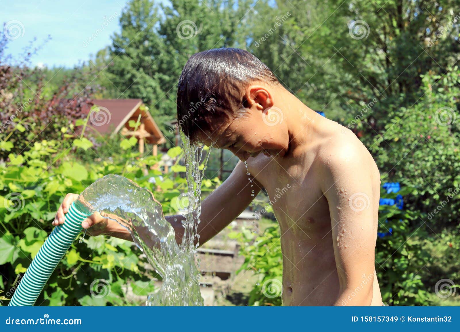 The Boy With Splash Water In Very Hot Summer Day Outdoors Stock Image ...