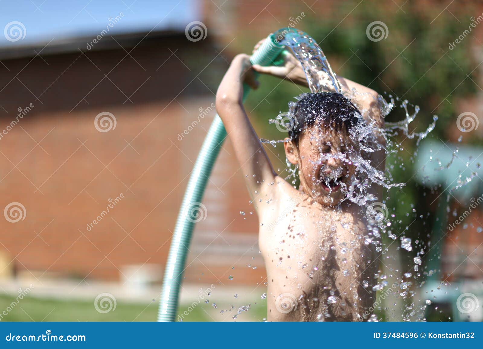 Boy With Splash Water In Very Hot Summer Day Outdoors Royalty-Free ...