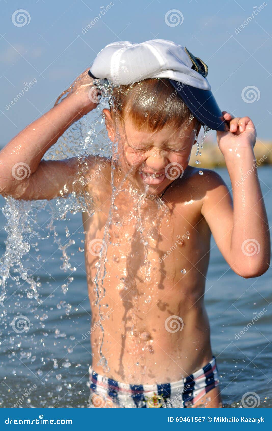 Boy SPLASHING water stock image. Image of sunlight, childhood - 69461567