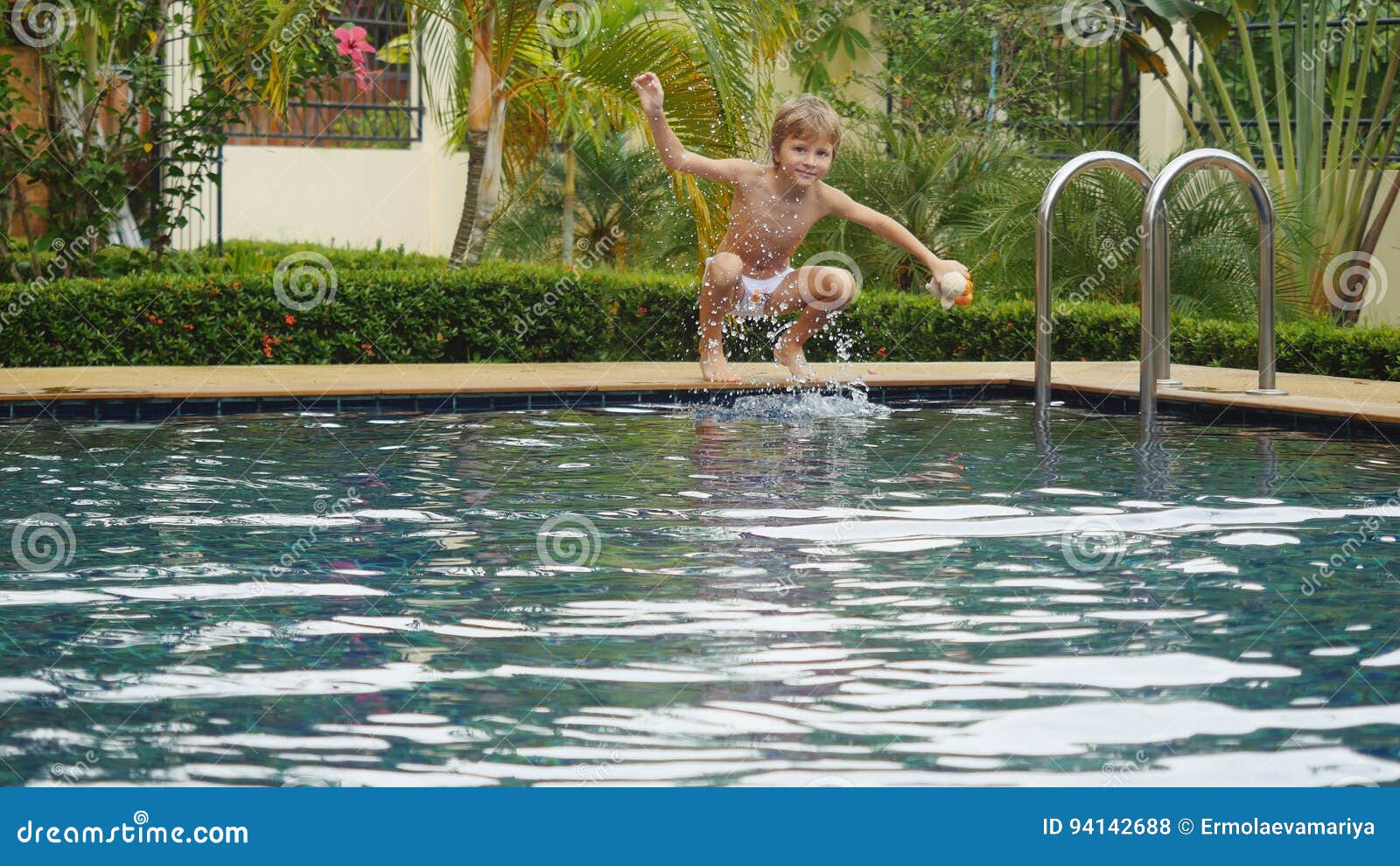 Boy Splashing Water into a Swimming Pool Stock Photo - Image of nature ...