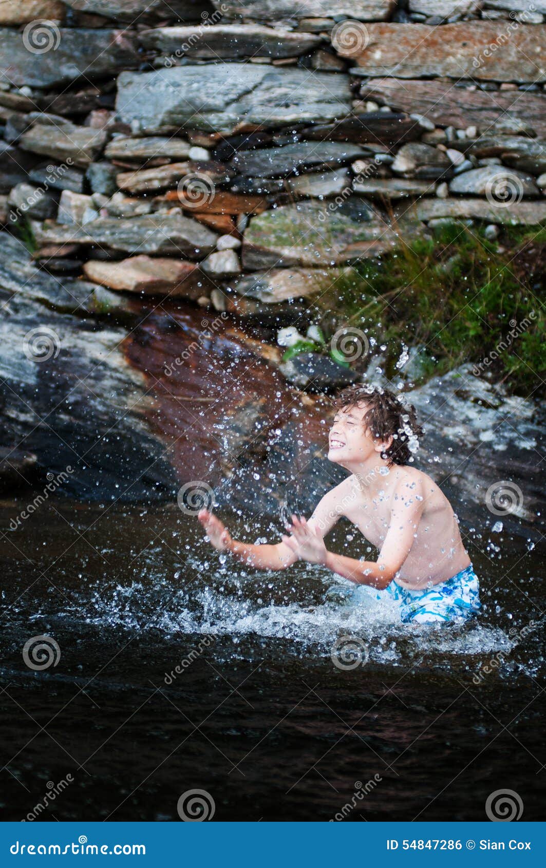 Boy splashing water stock photo. Image of joyful, swim - 54847286