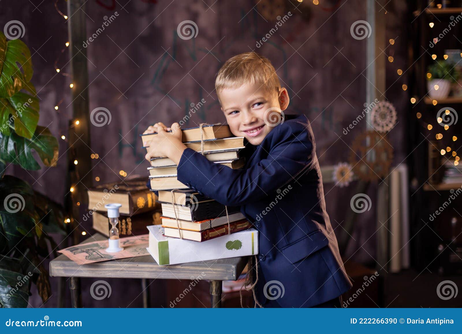 Boy with a Stack of Books Comes from the Library. Smart Schoolboy ...