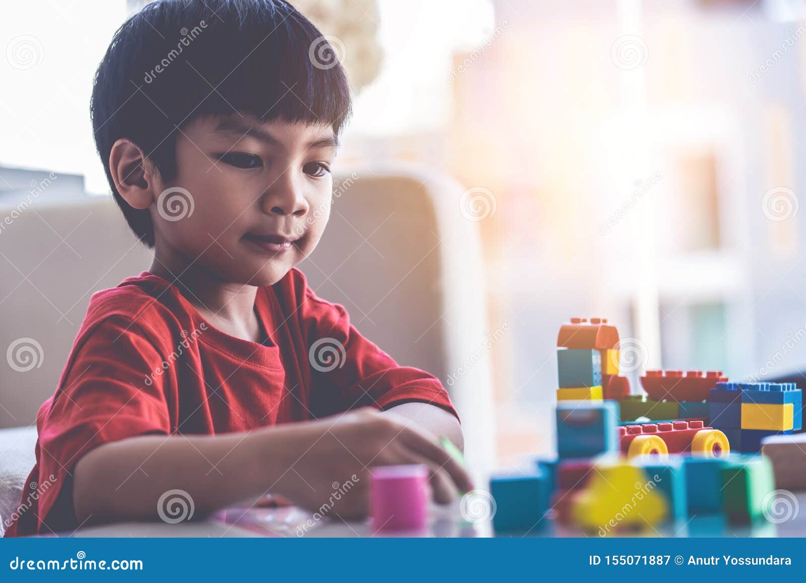 Boy Stacking Toy Blocks on a Living Room Table Stock Image - Image of ...