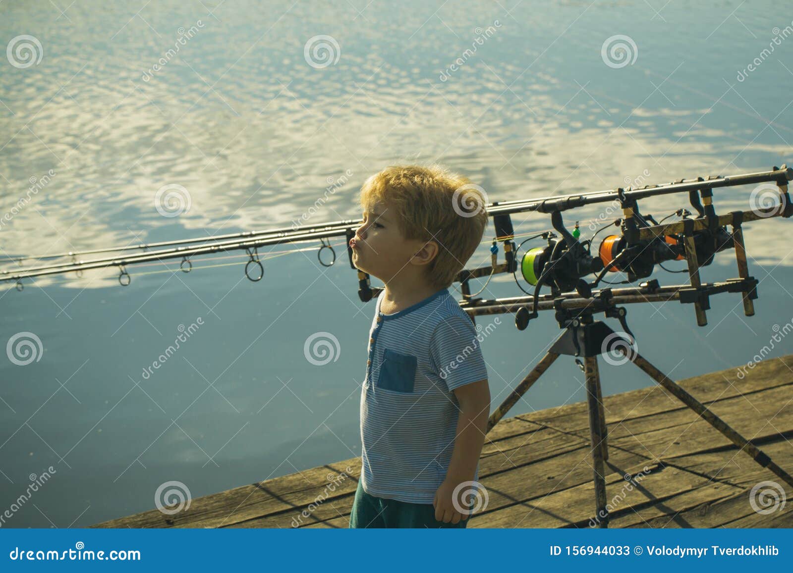 Boy stand on fishing pier stock image. Image of river - 156944033