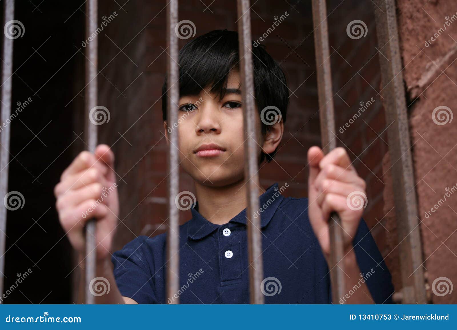 Boy Standing Behind Bars Royalty-Free Stock Photography | CartoonDealer ...