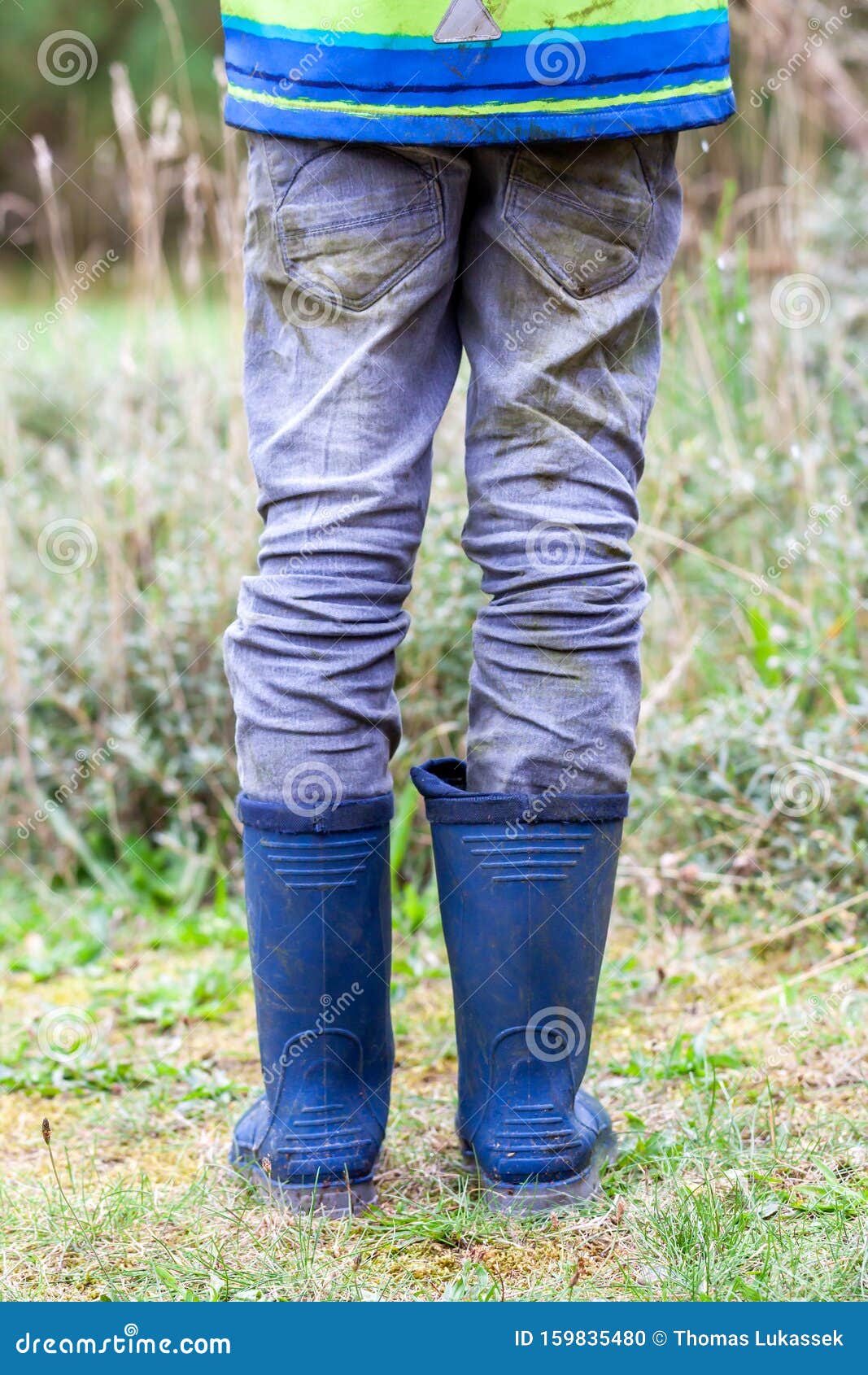 Boy Standing on the Green Wearing Blue Wellies Stock Photo - Image of ...