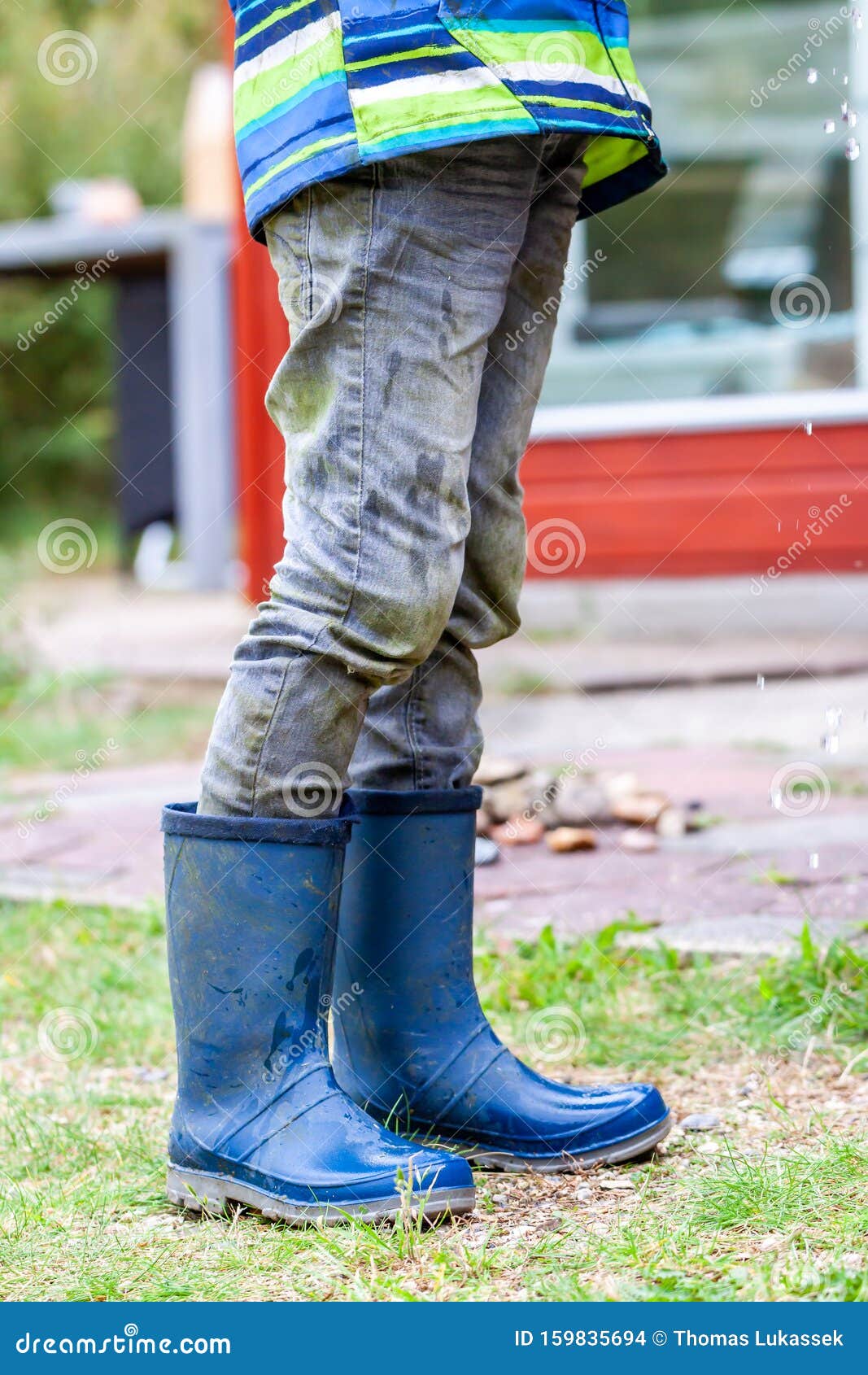 Boy Standing on the Green Wearing Blue Wellies Stock Photo - Image of ...