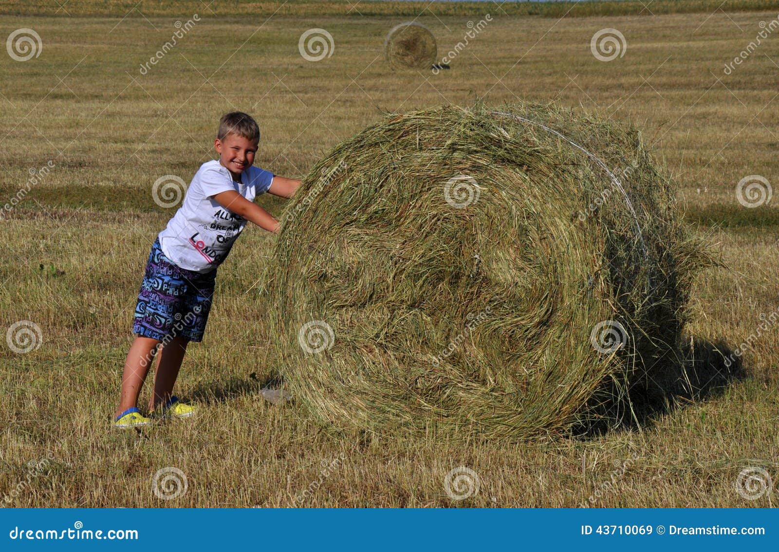 Boy Standing Near Haystacks Stock Image - Image of standing, haystack ...