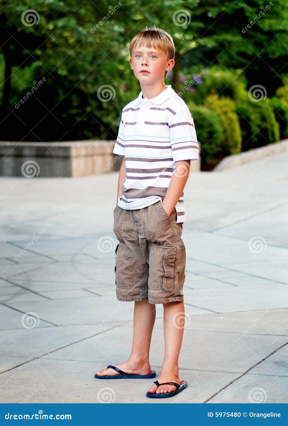 Boy Standing Outisde on Sidewalk - Vertical Stock Photo - Image of ...