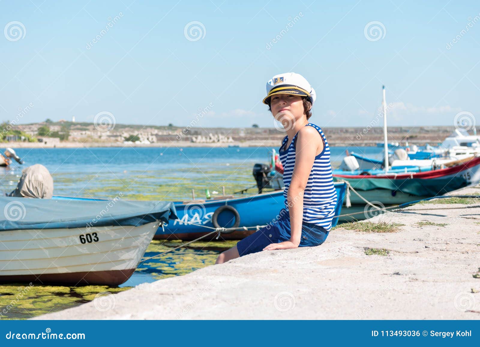 The Boy is Standing on the Pier Stock Photo - Image of water, vacation ...