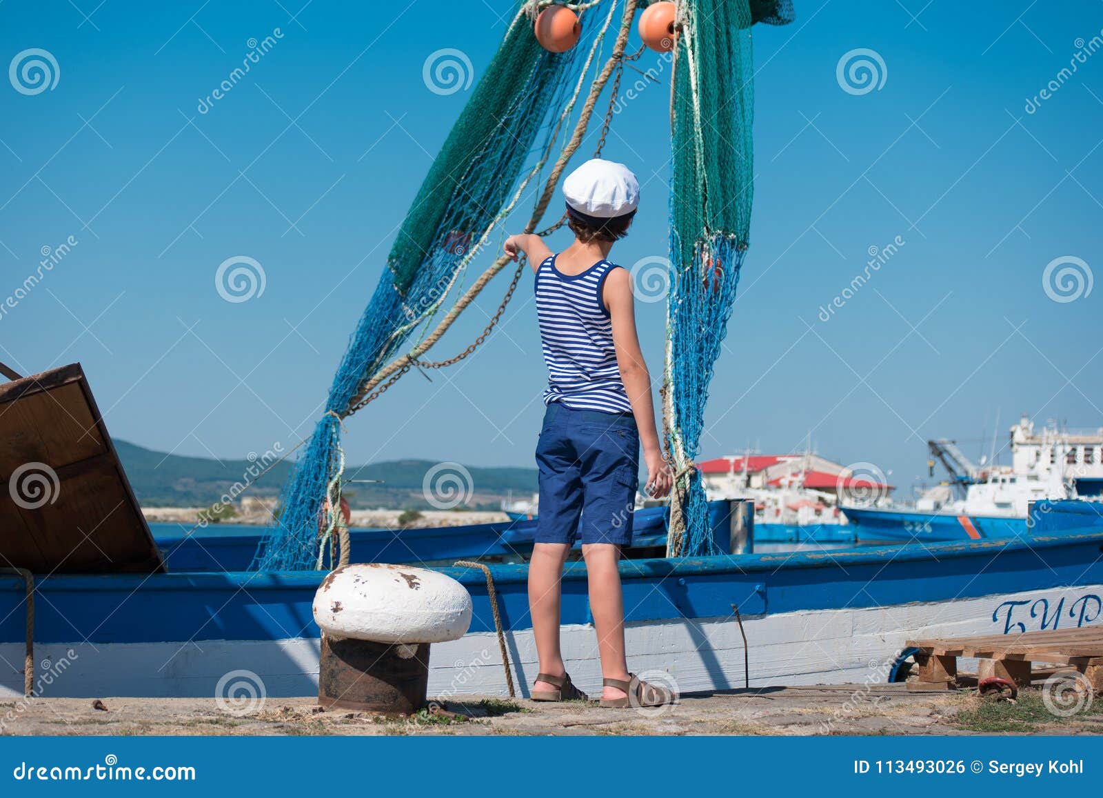The Boy is Standing on the Pier Stock Photo - Image of seaport, port ...