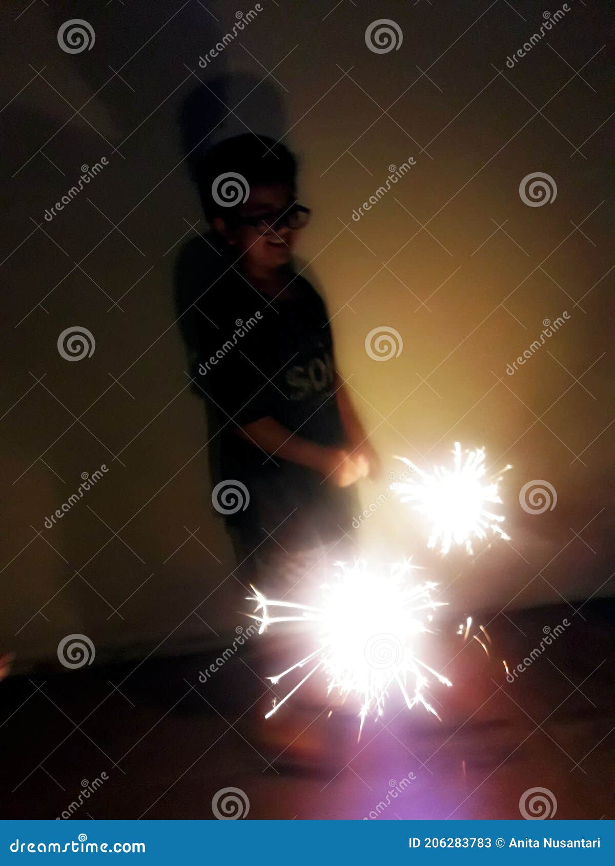 A Boy Standing Playing Fireworks with His Hands Stock Image - Image of ...