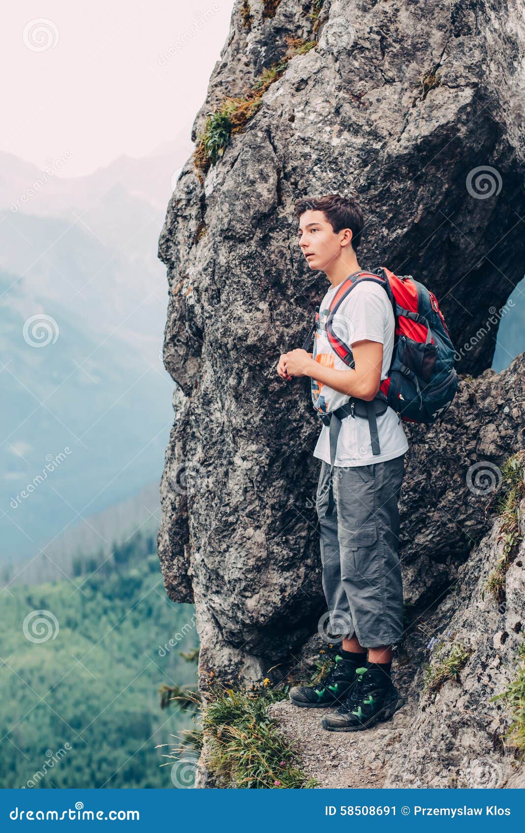 Boy Standing on the Rocks in the Mountains Stock Image - Image of child ...