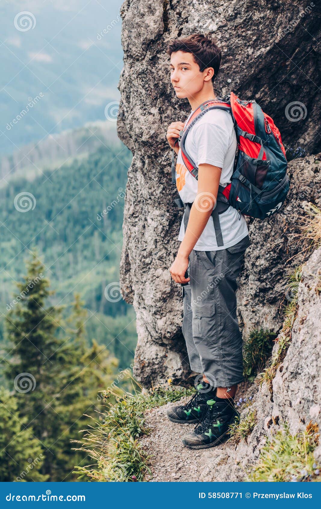Boy Standing on the Rocks in the Mountains Stock Image - Image of child ...