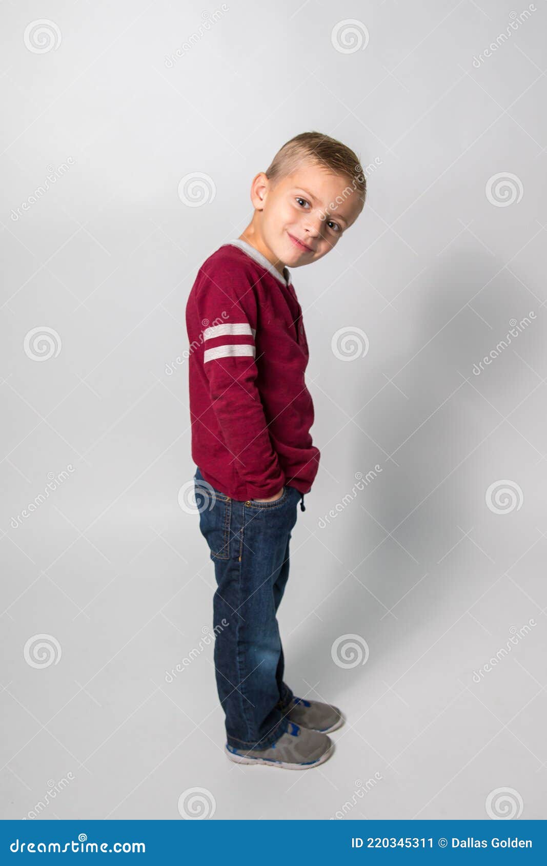 Boy Standing Sideways on White Background Stock Image - Image of ...