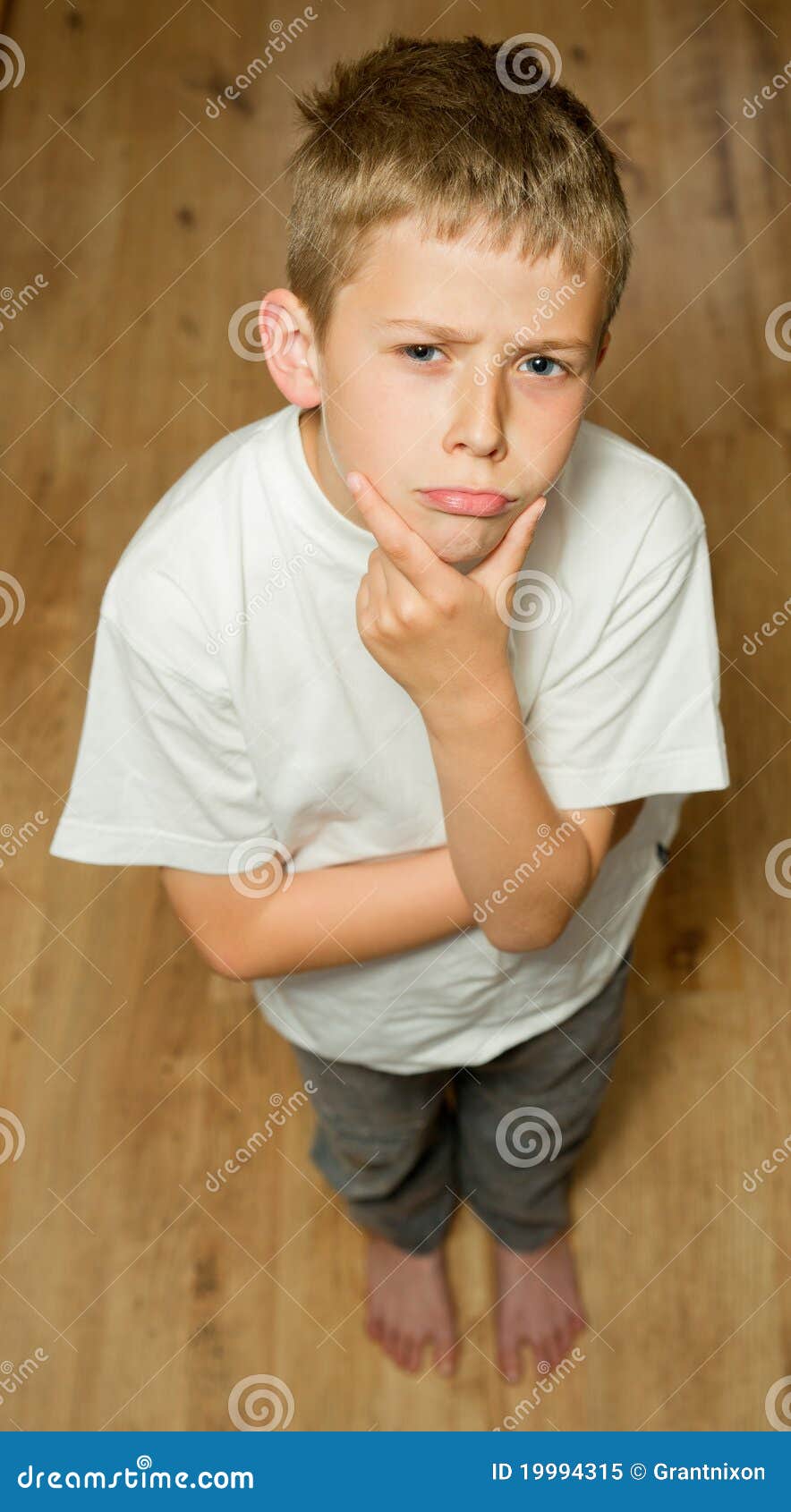 Boy standing and thinking stock image. Image of looking - 19994315
