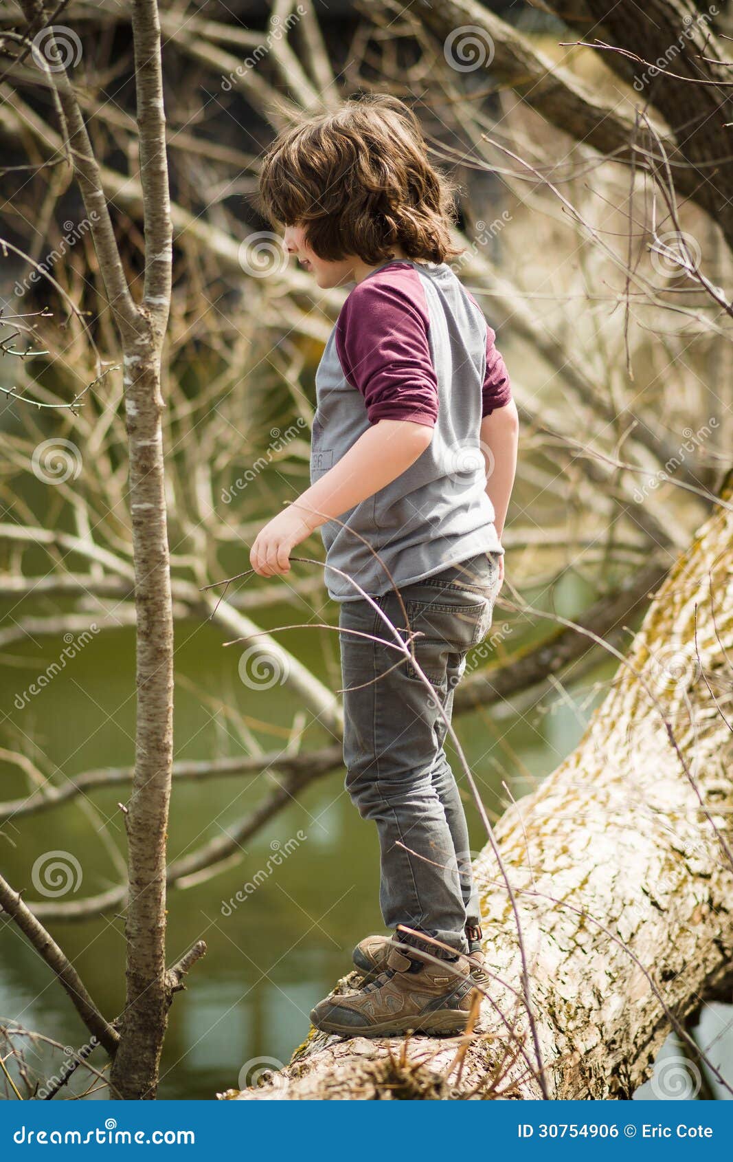 Boy standing on a tree stock photo. Image of caucasian - 30754906