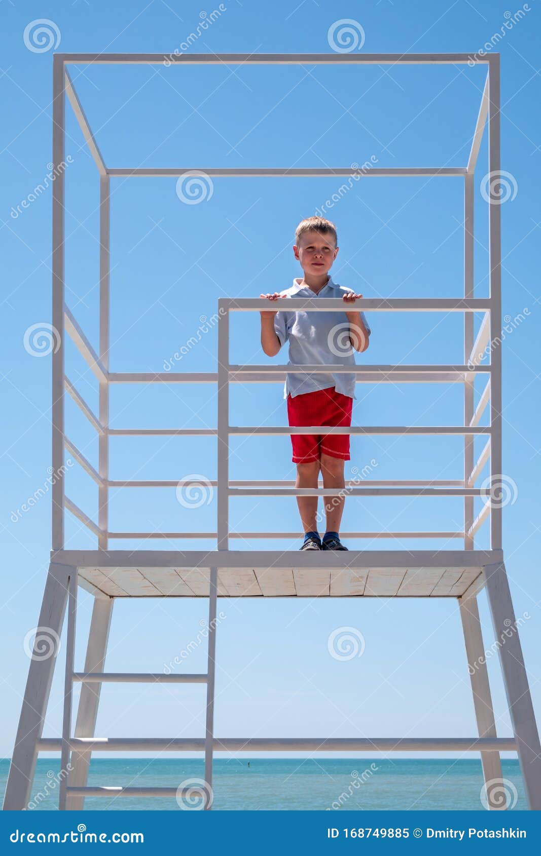 The Boy Stands in a Rescue Tower on the Beach Stock Image - Image of ...