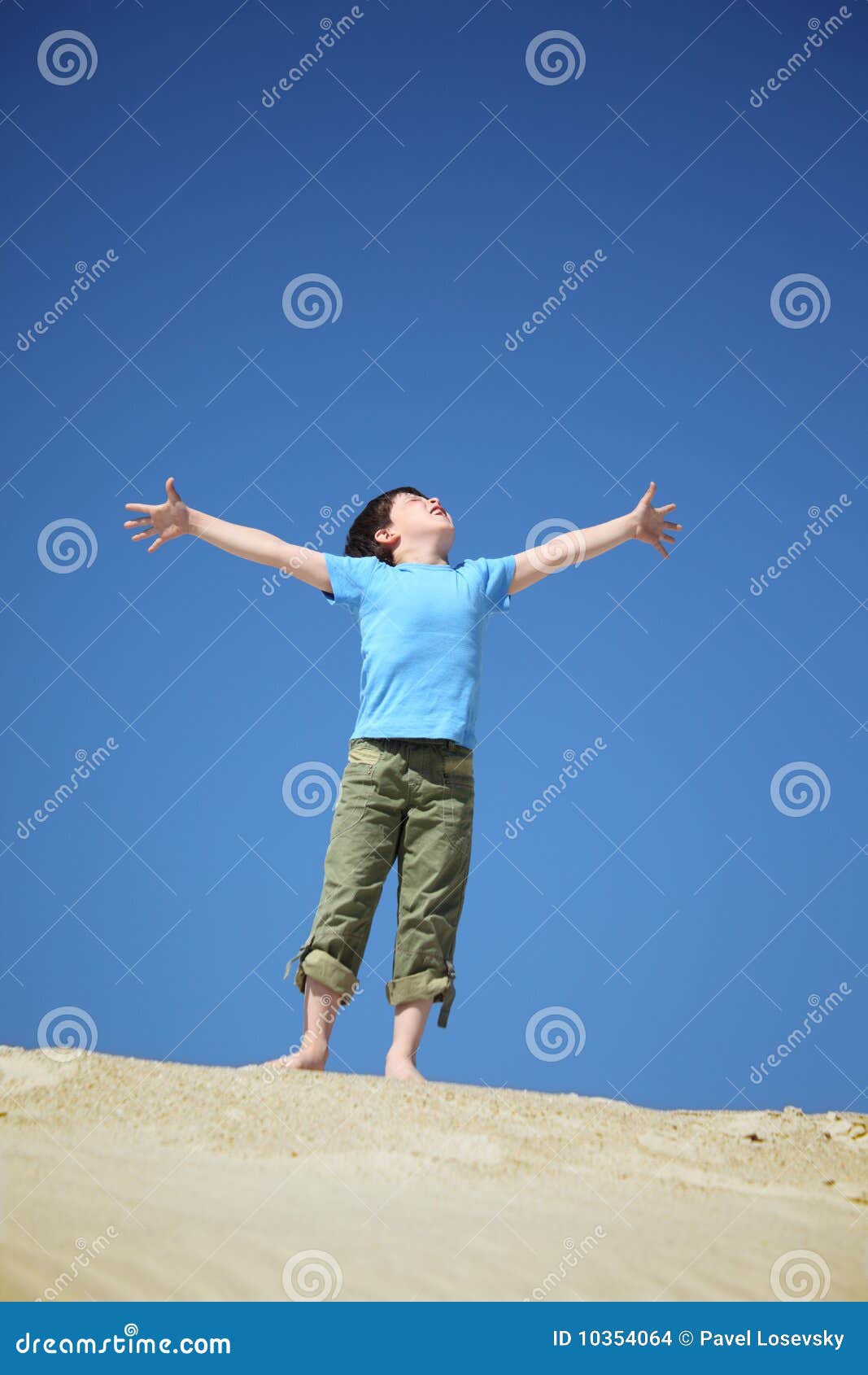 Boy Stands on Sand and Looks Upwards Stock Photo - Image of outdoor ...