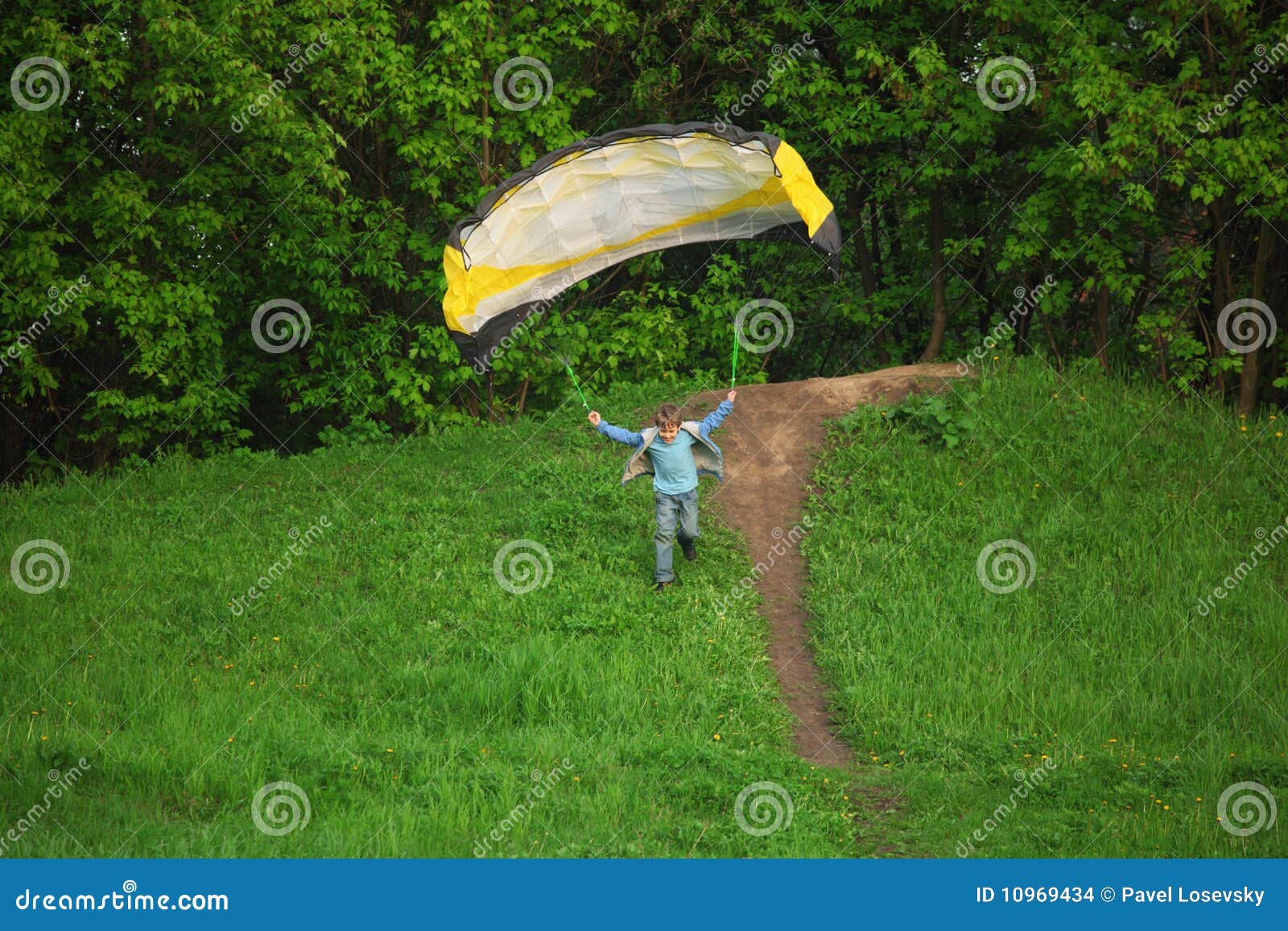 Boy Starts To Fly Using Parachute Stock Photo - Image of caucasian ...